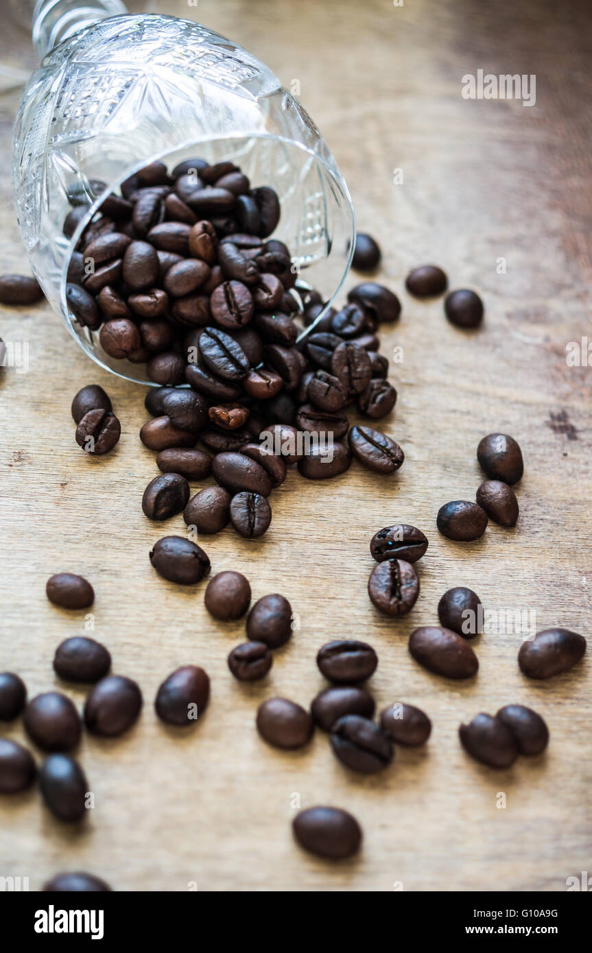Coffee beans on rustic background Stock Photo - Alamy