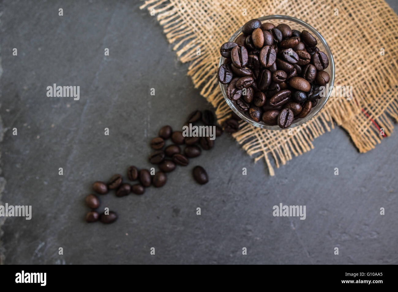 Coffee beans on rustic background Stock Photo - Alamy