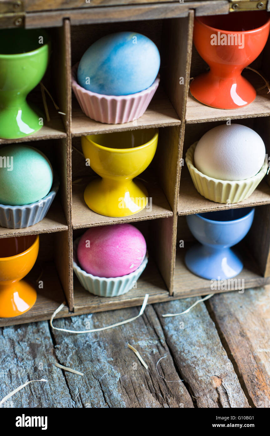 Easter eggs in a vintage box on rustic background Stock Photo - Alamy