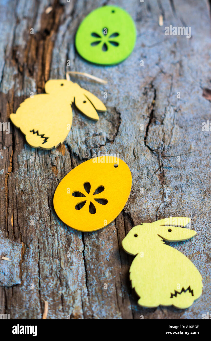 Easter time decoration with colored eggs and Easter bunny on rustic ...