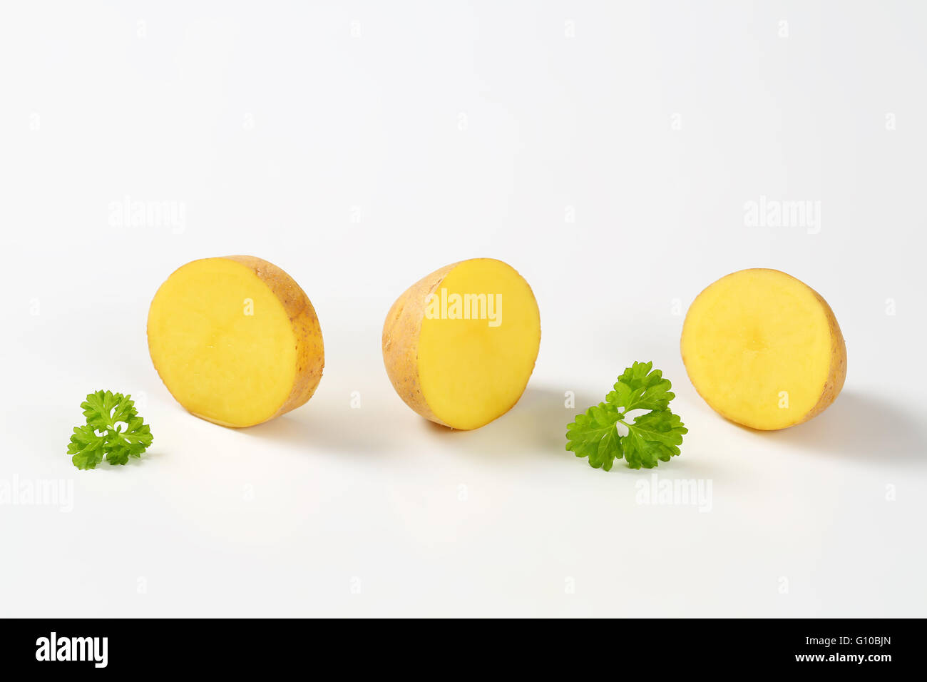 sliced raw potato on white background Stock Photo - Alamy