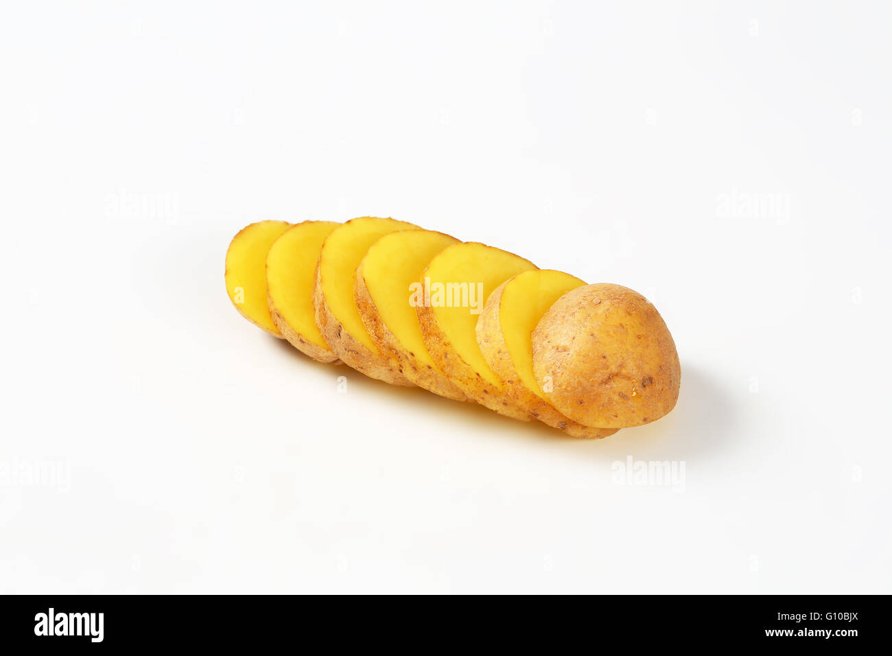 sliced raw potato on white background Stock Photo - Alamy