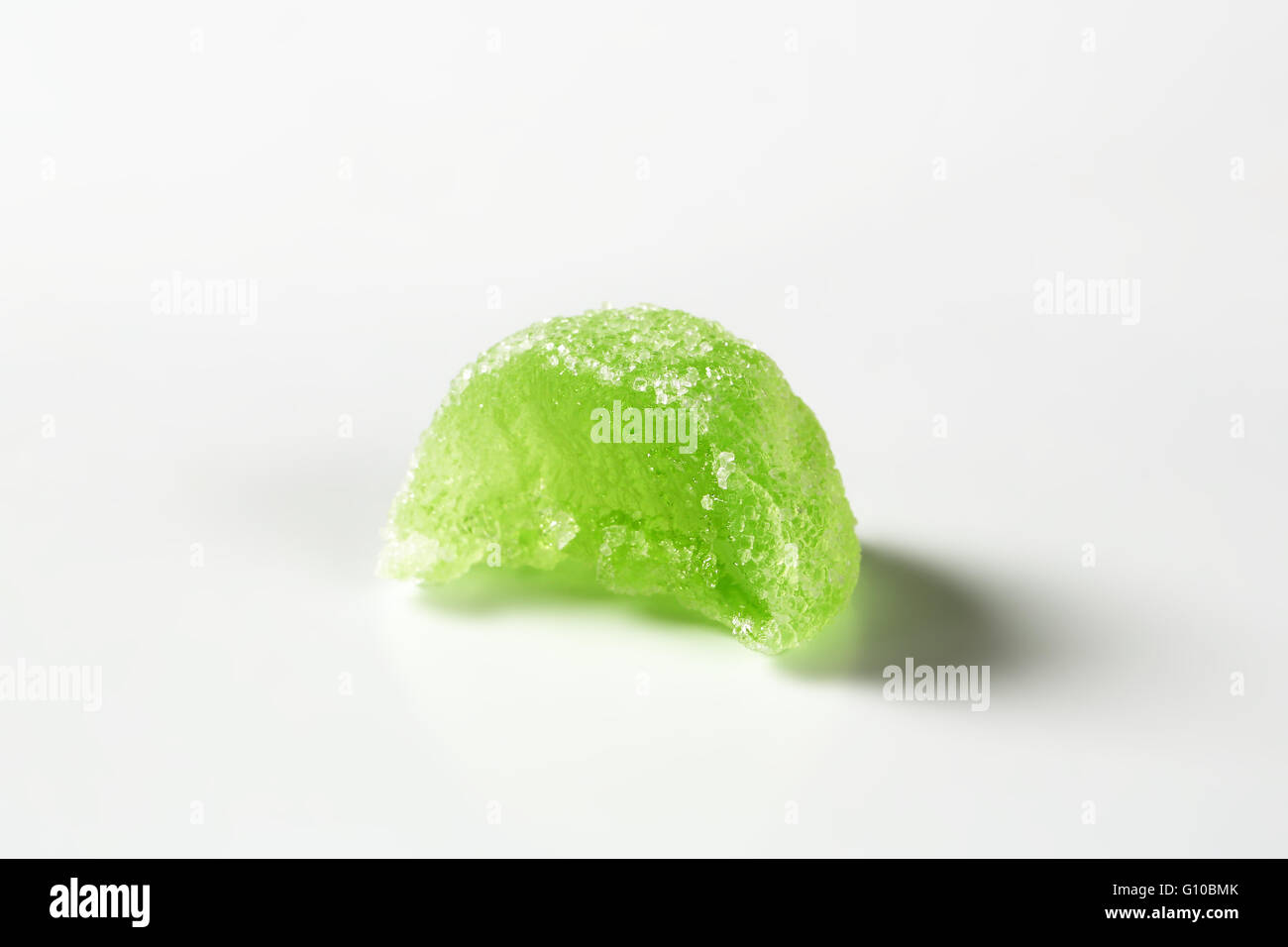 bitten green jelly candy on white background Stock Photo - Alamy
