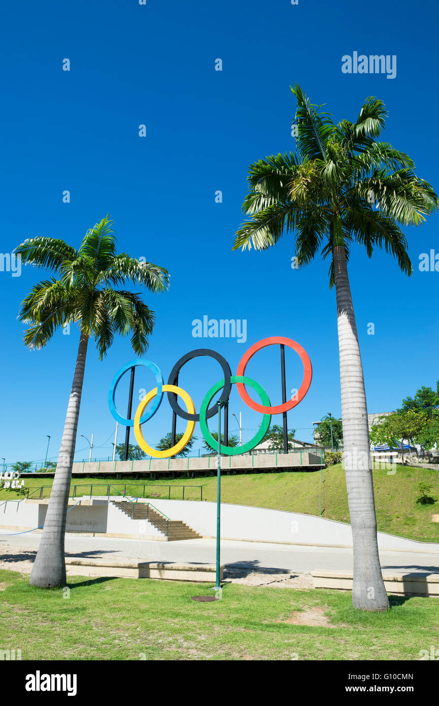 RIO DE JANEIRO - MARCH 18, 2016: Olympic rings stand under tall palm ...