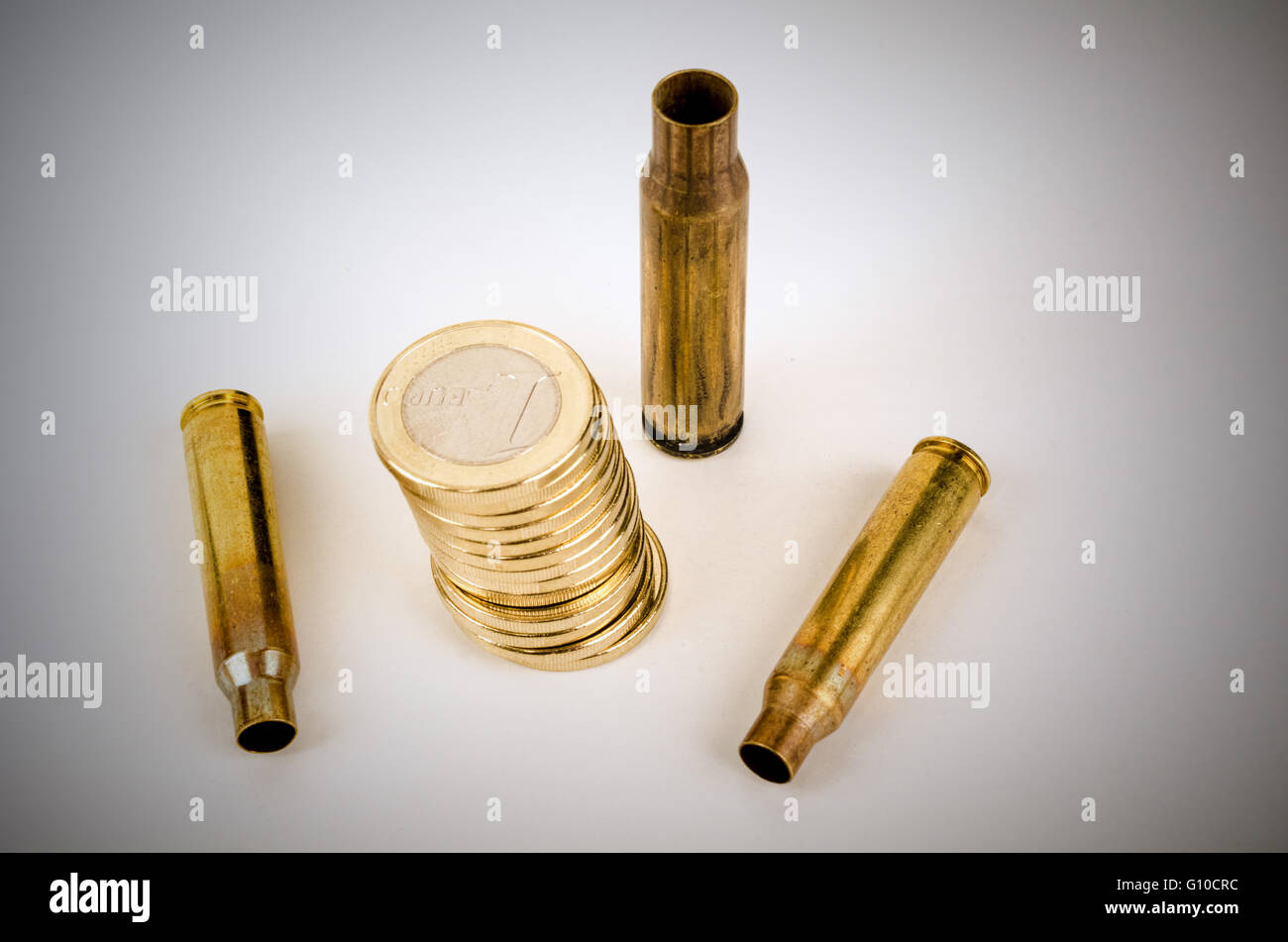 Bullet shells and coins, a financial crime concept Stock Photo - Alamy