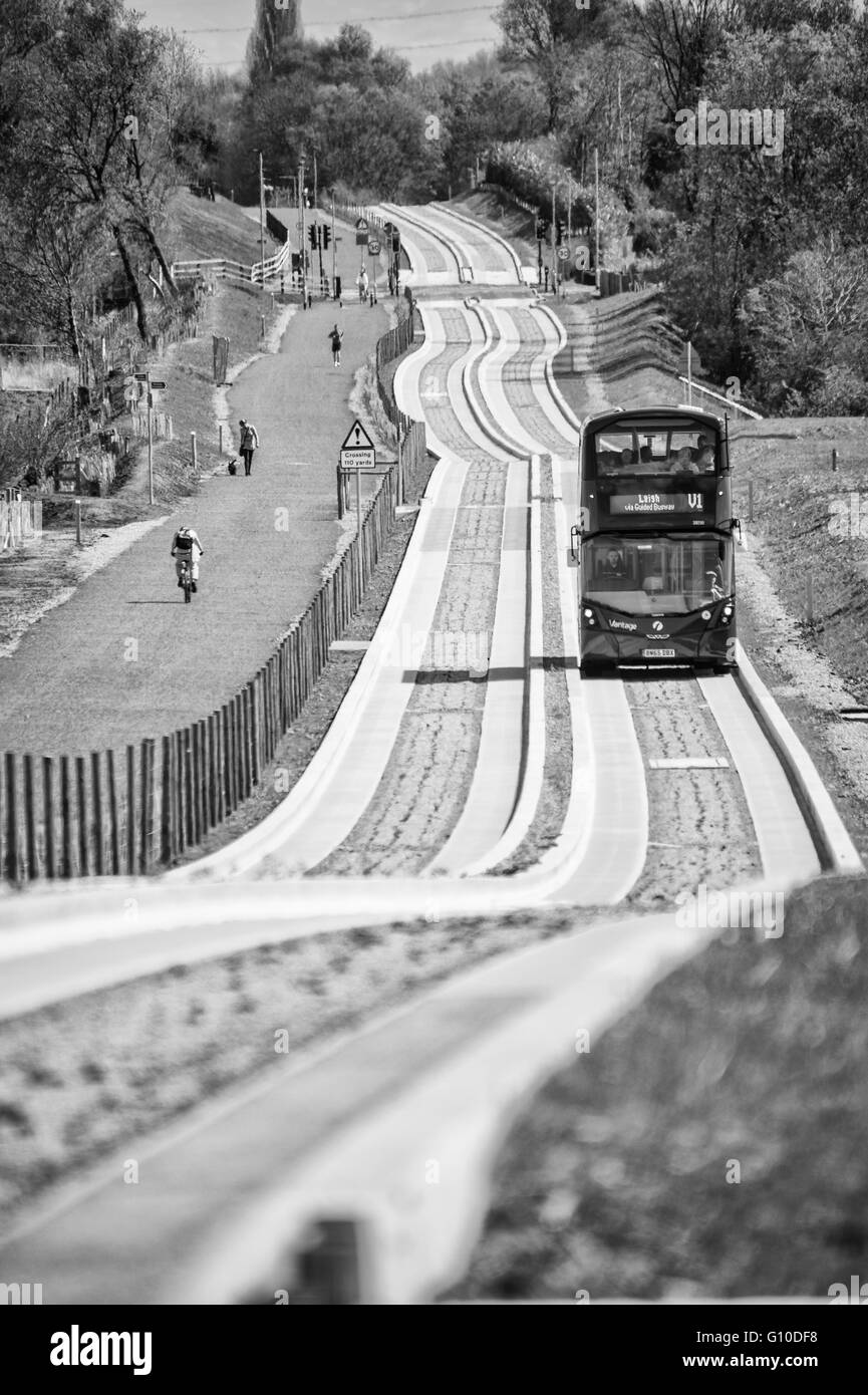 Double decker bus approaching on new concrete guided busway Stock Photo ...