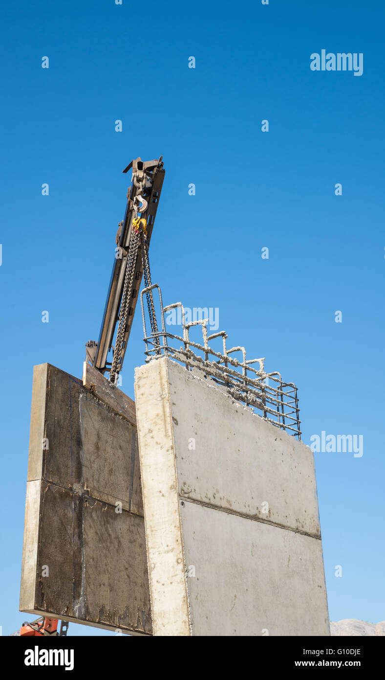 Crane removing formwork encasement from a finished wall Stock Photo - Alamy