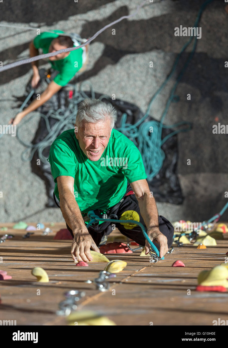 Smiling Mature Man on Extreme Climbing Wall Stock Photo - Alamy