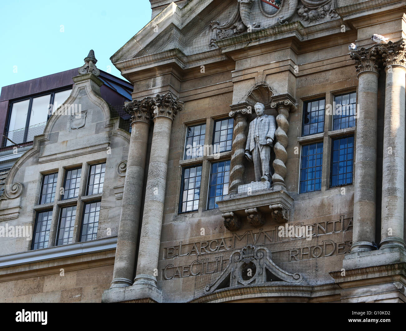 The statue of Cecil John Rhodes above the main door to Oriel College on High Street, Oxford ...
