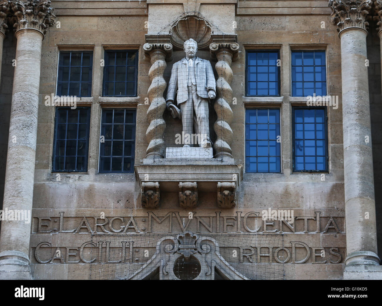 The statue of Cecil John Rhodes above the main door to Oriel College on High Street, Oxford ...