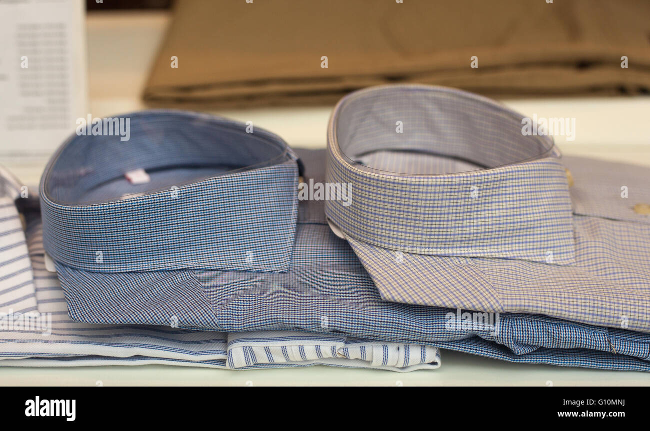 View of male shirts exposed in the clothes shop Stock Photo - Alamy