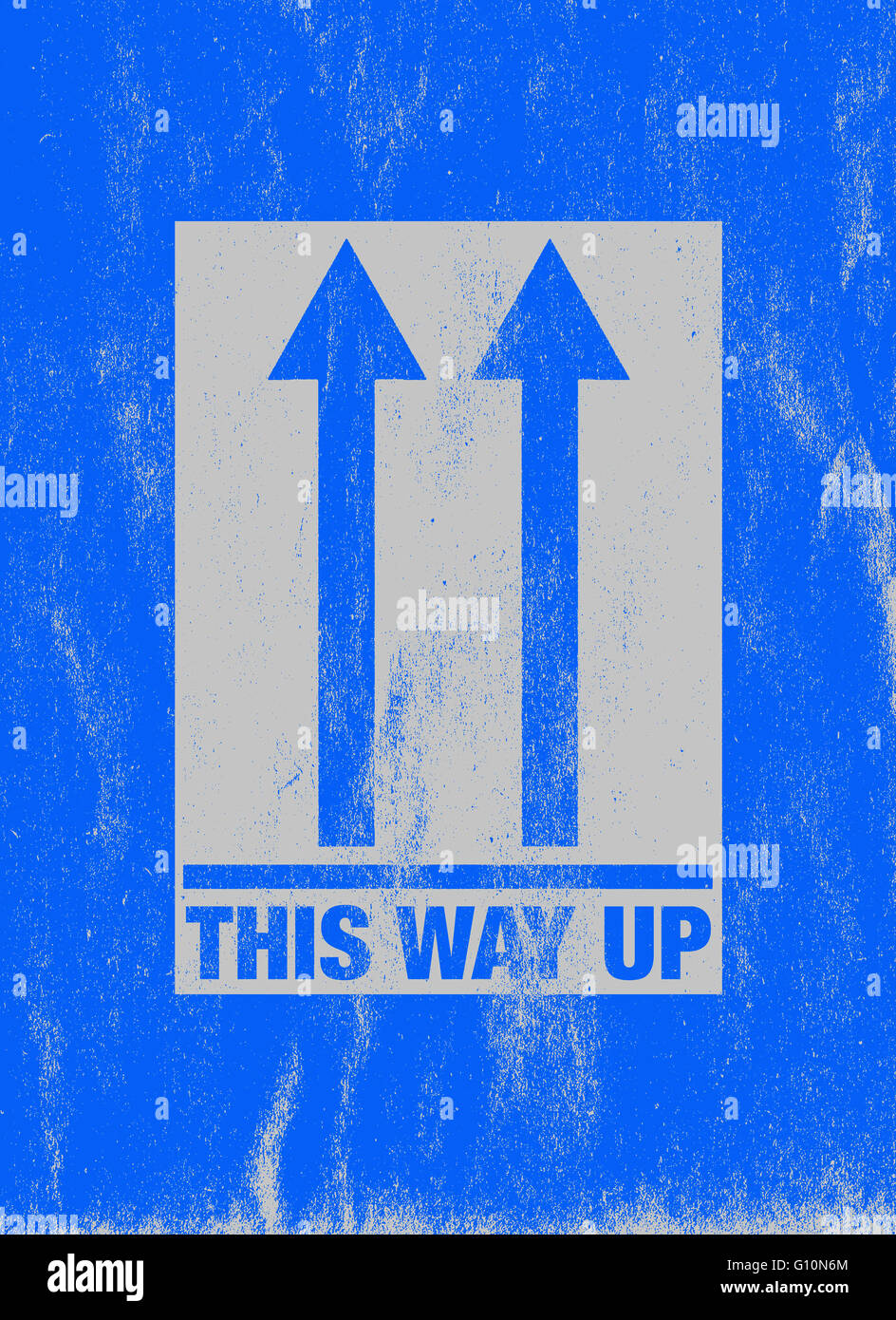Scratched blue 'This way up' sign Stock Photo - Alamy