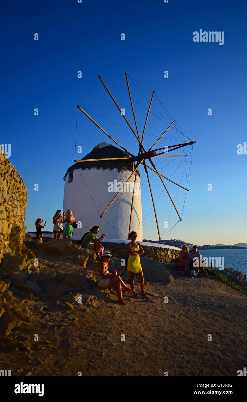 People enjoying sunset from traditional windmills (Kato Milli) in ...