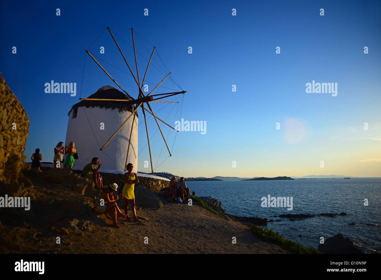 People enjoying sunset from traditional windmills (Kato Milli) in ...