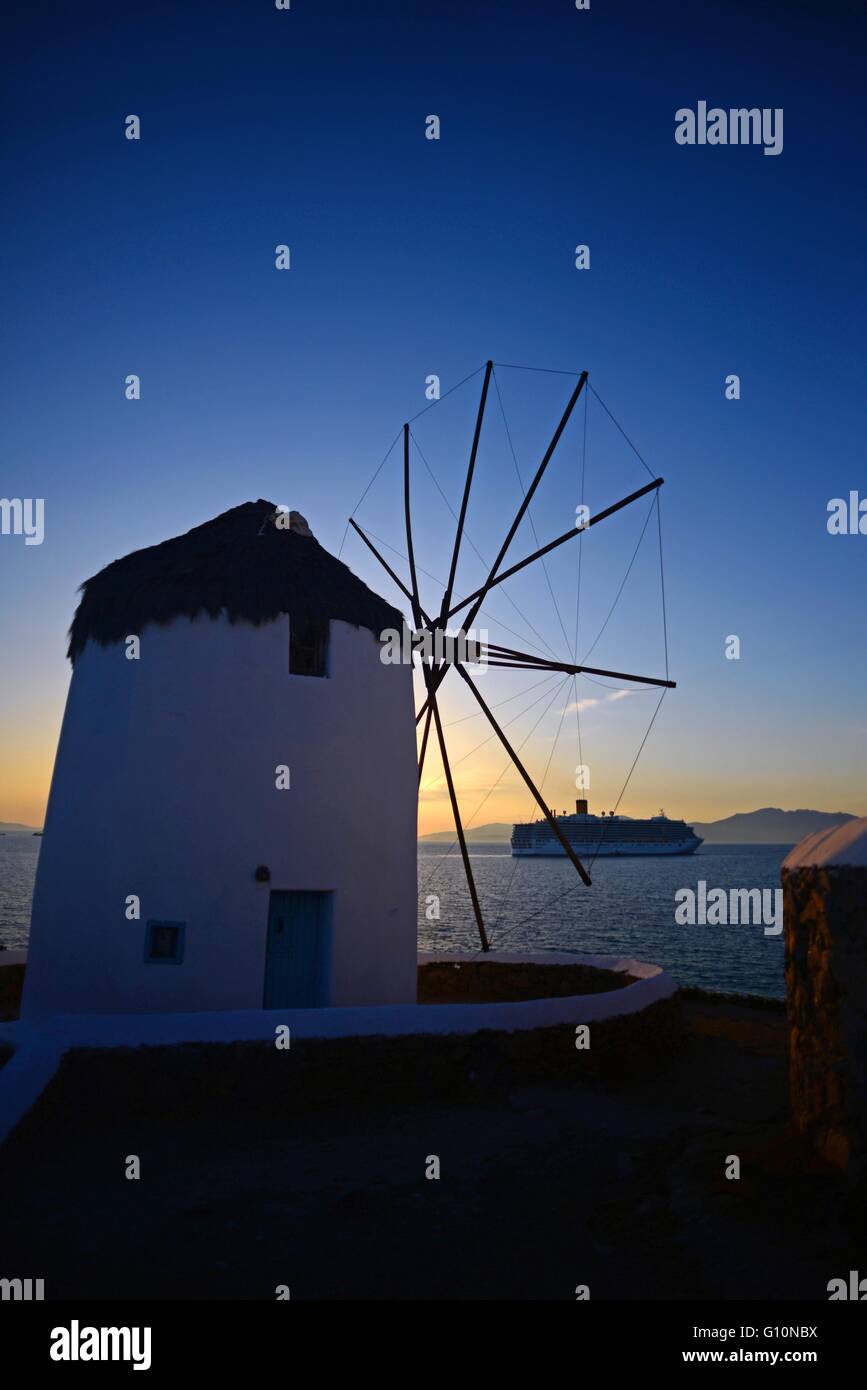 Traditional windmills (Kato Milli) at sunset in Mykonos town, Greece ...
