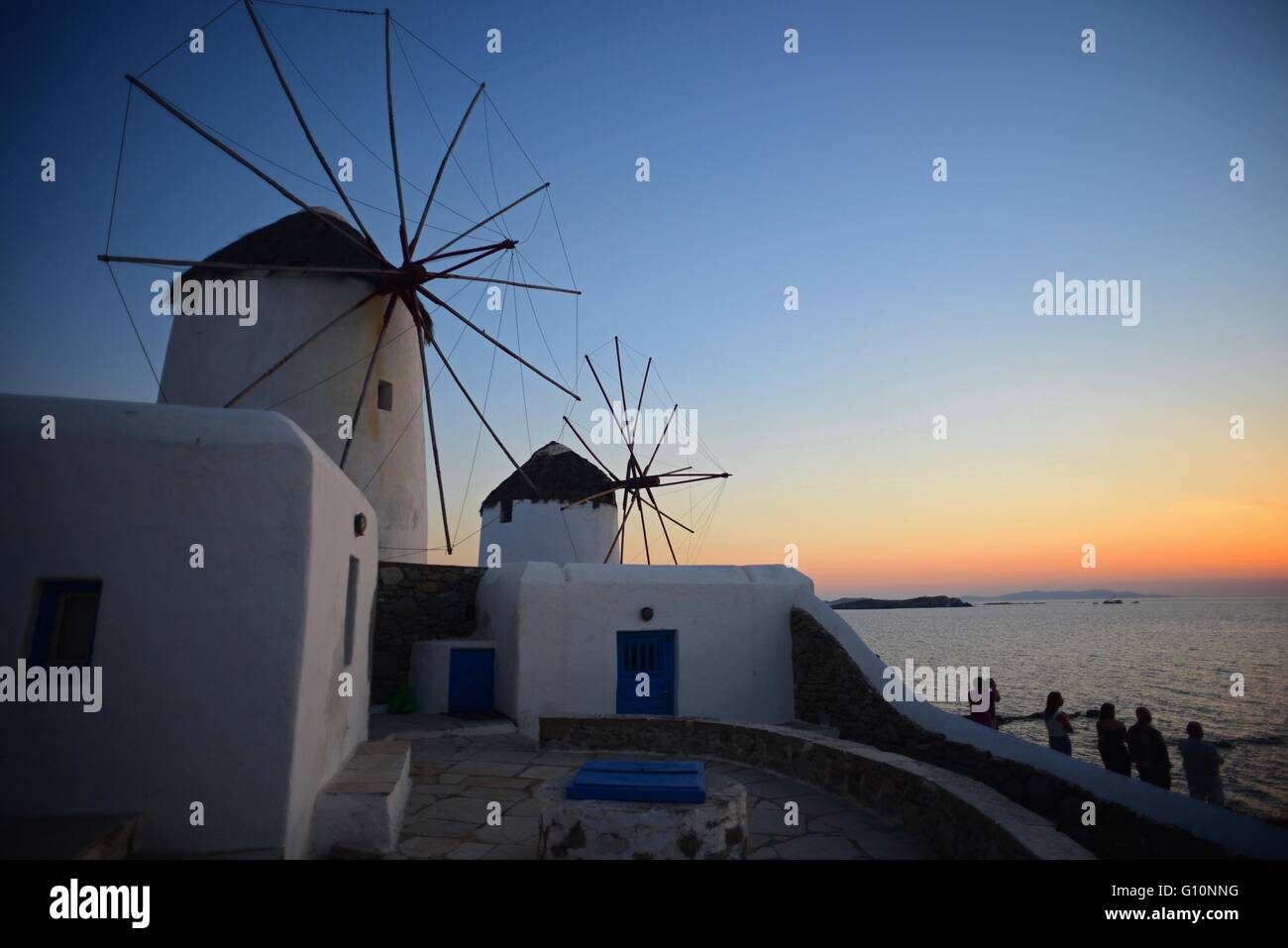 People enjoying sunset from traditional windmills (Kato Milli) in ...