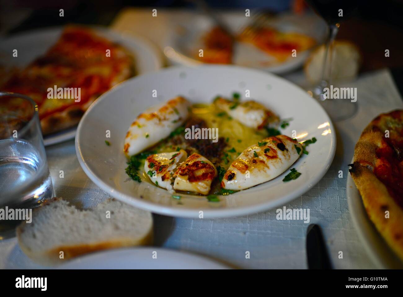 Grilled cuttlefish in restaurant, Venice, Italy Stock Photo - Alamy