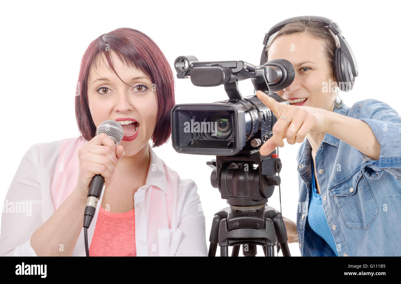 a young woman journalist with a microphone and camerawoman Stock Photo ...