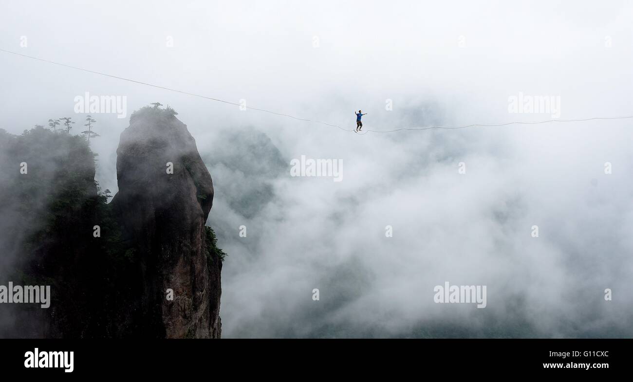 Taizhou, China's Zhejiang Province. 7th May, 2016. A slackline walker ...