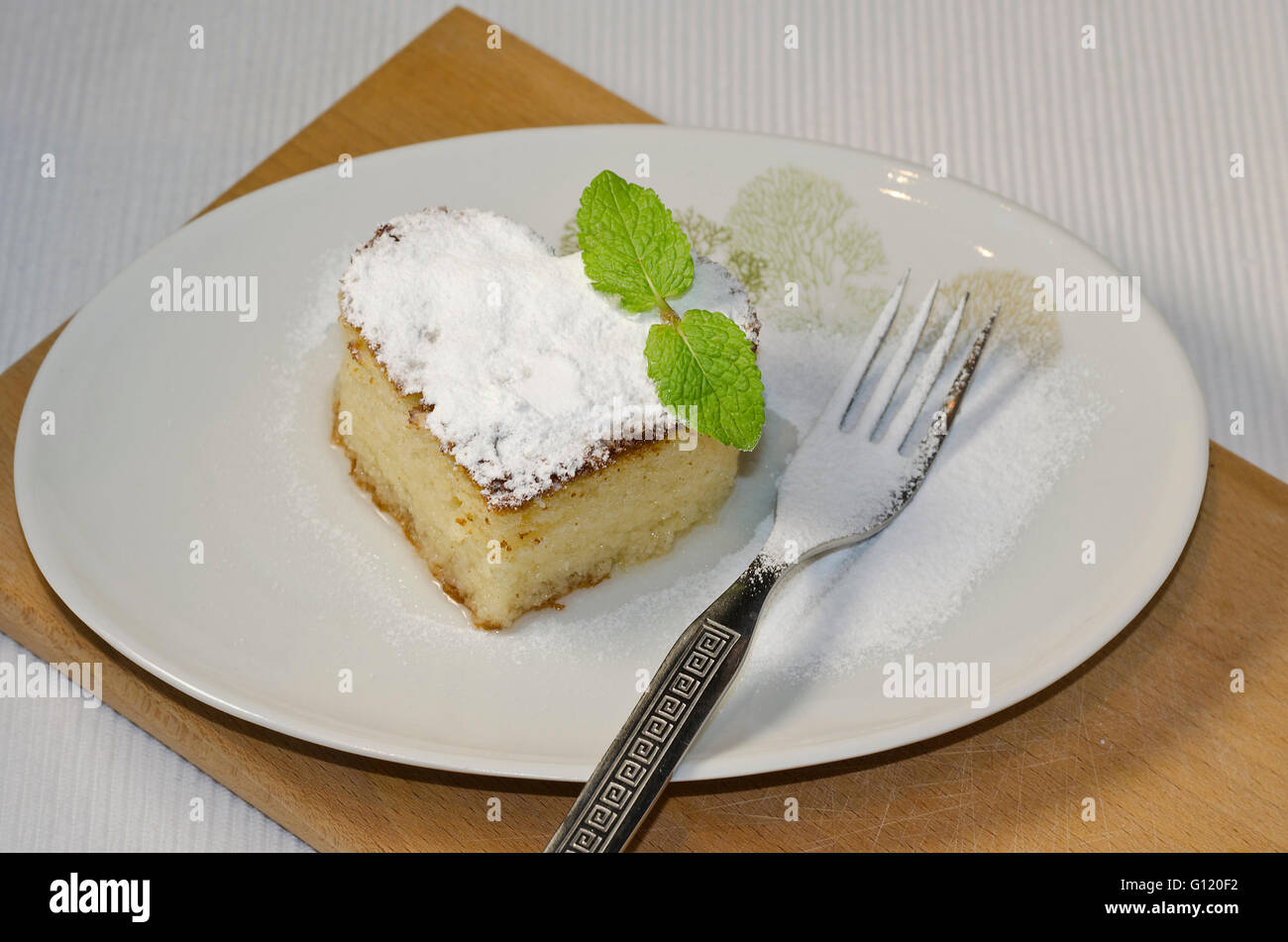 Traditional Turkish dessert revani on wooden board Stock Photo - Alamy