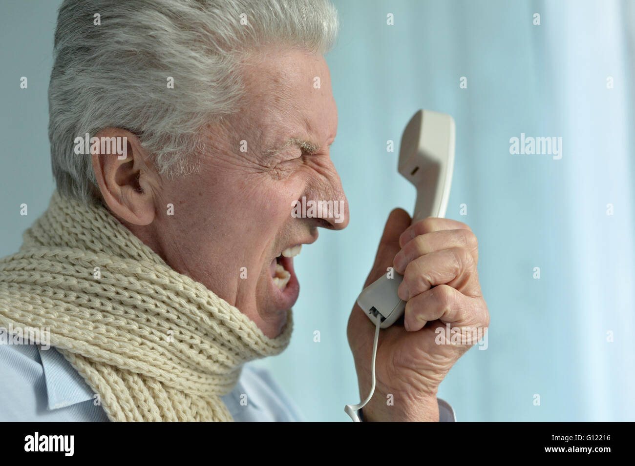 Angry pensioner and phone hi-res stock photography and images - Alamy