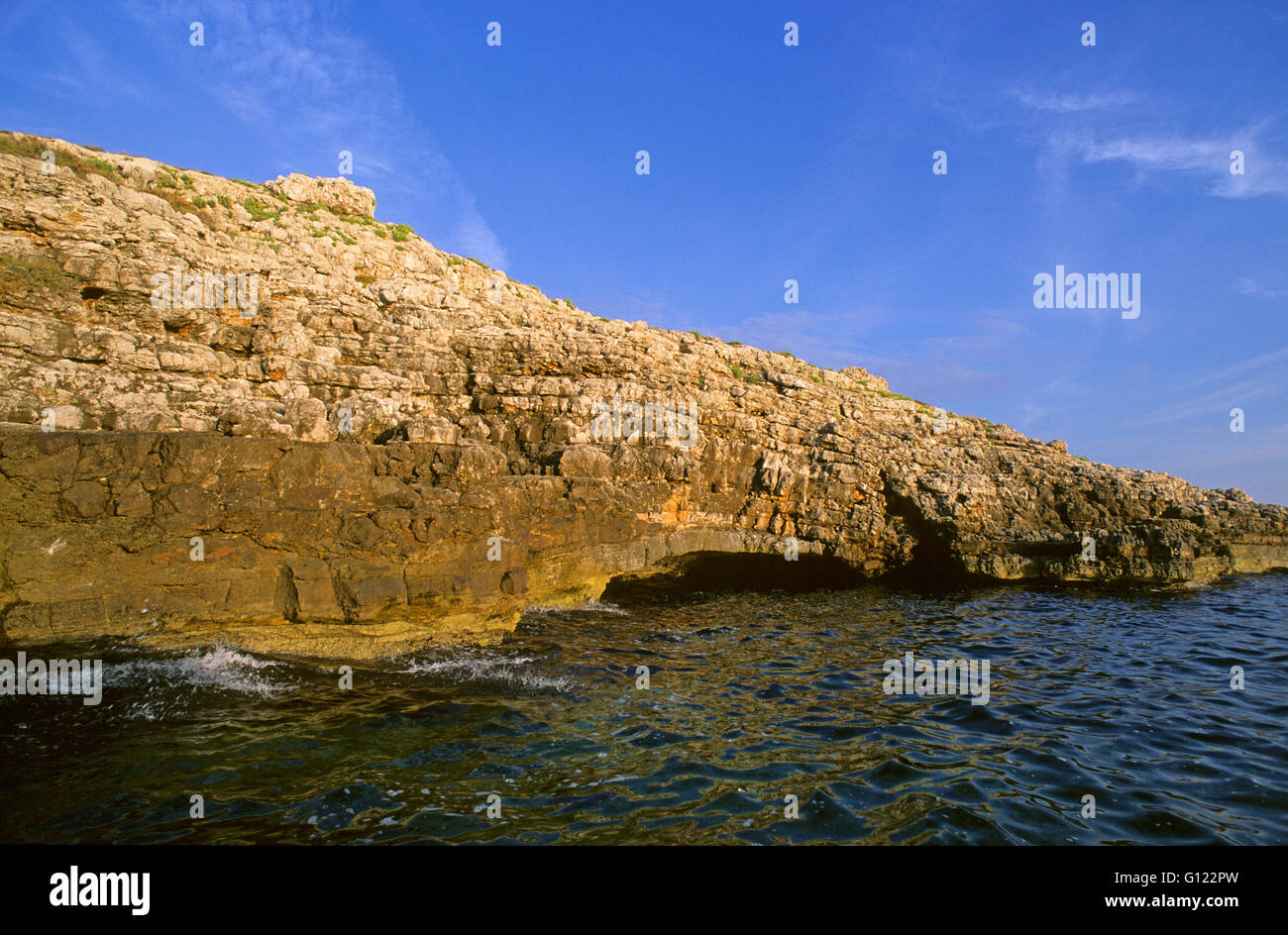 Rocky coast and sea cave near Santa Maria di Leuca, Salento, Puglia ...