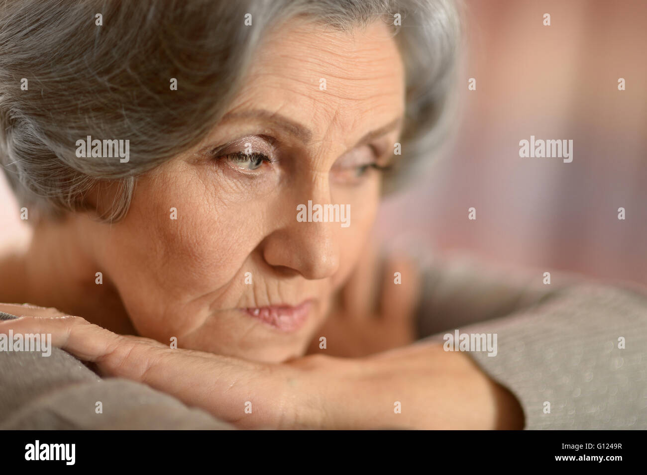 thinking elderly woman Stock Photo - Alamy