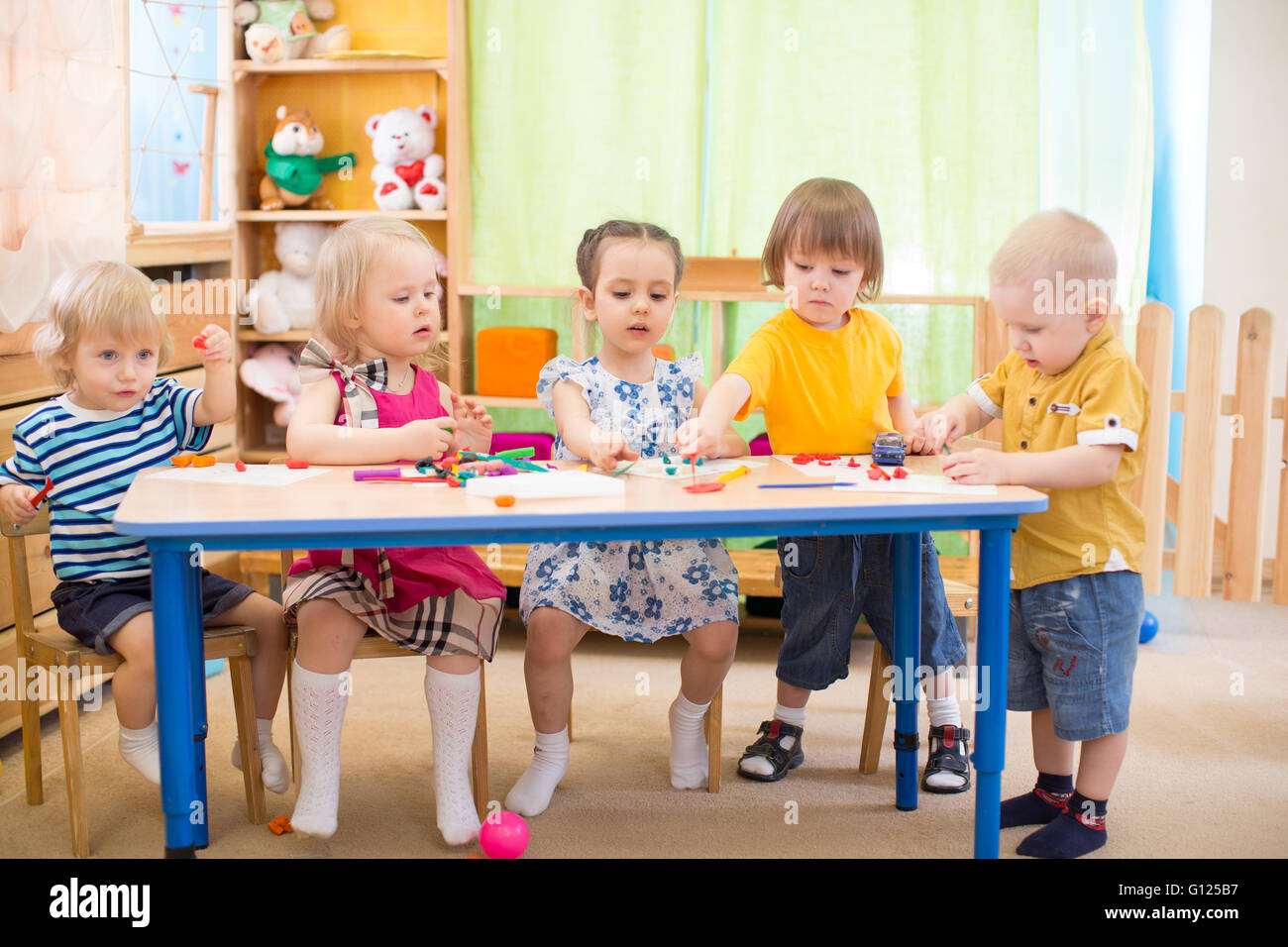 kids group learning arts and crafts in kindergarten playroom Stock ...