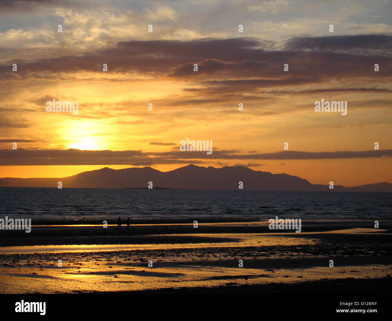 Sunset over the Isle of Arran Scotland, seen from Prestwick shore ...