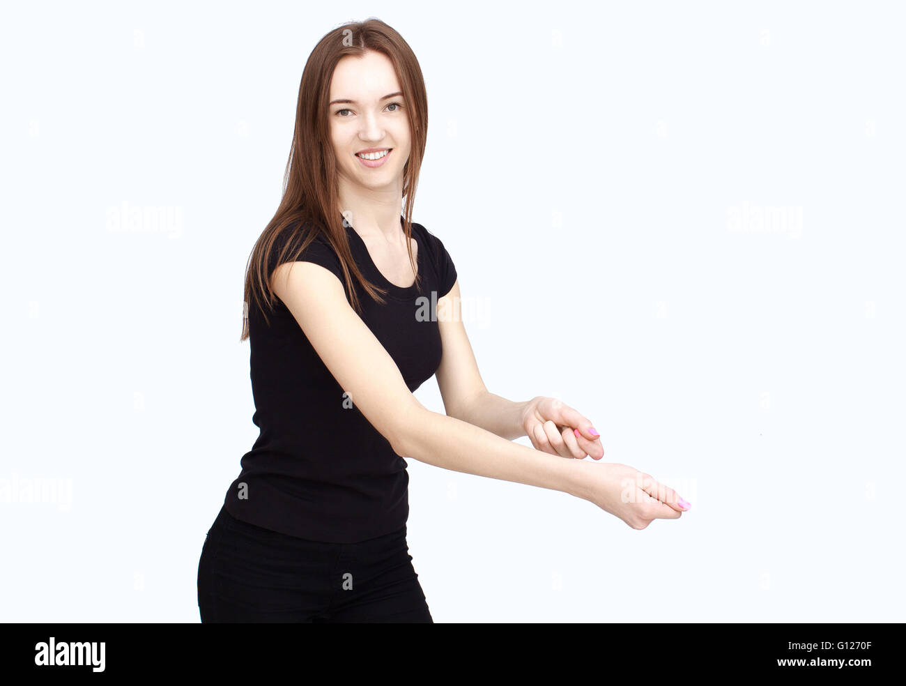 portrait of happy woman in black pulling something Stock Photo - Alamy