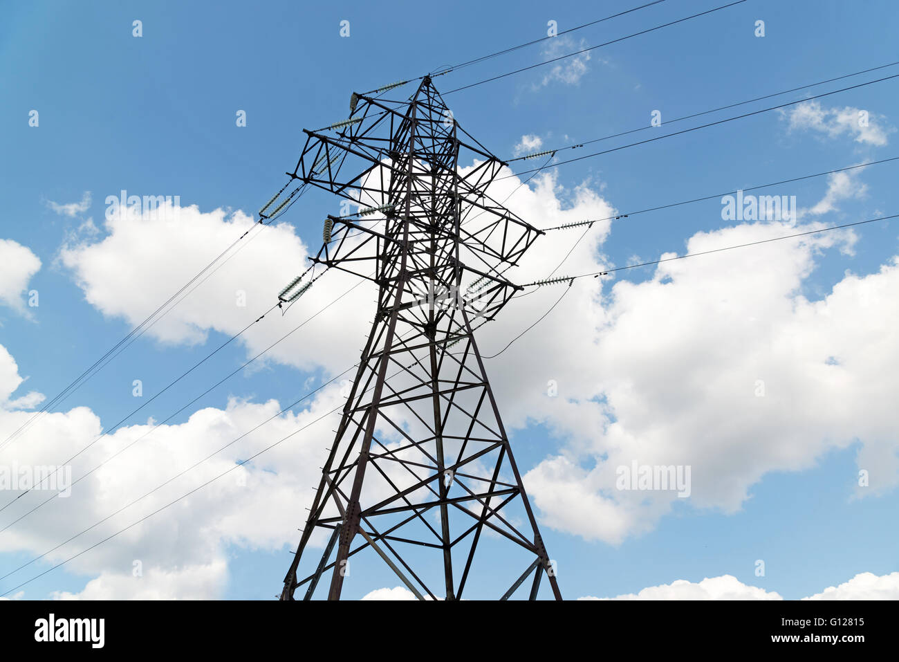 High-voltage power line on sky background Stock Photo - Alamy
