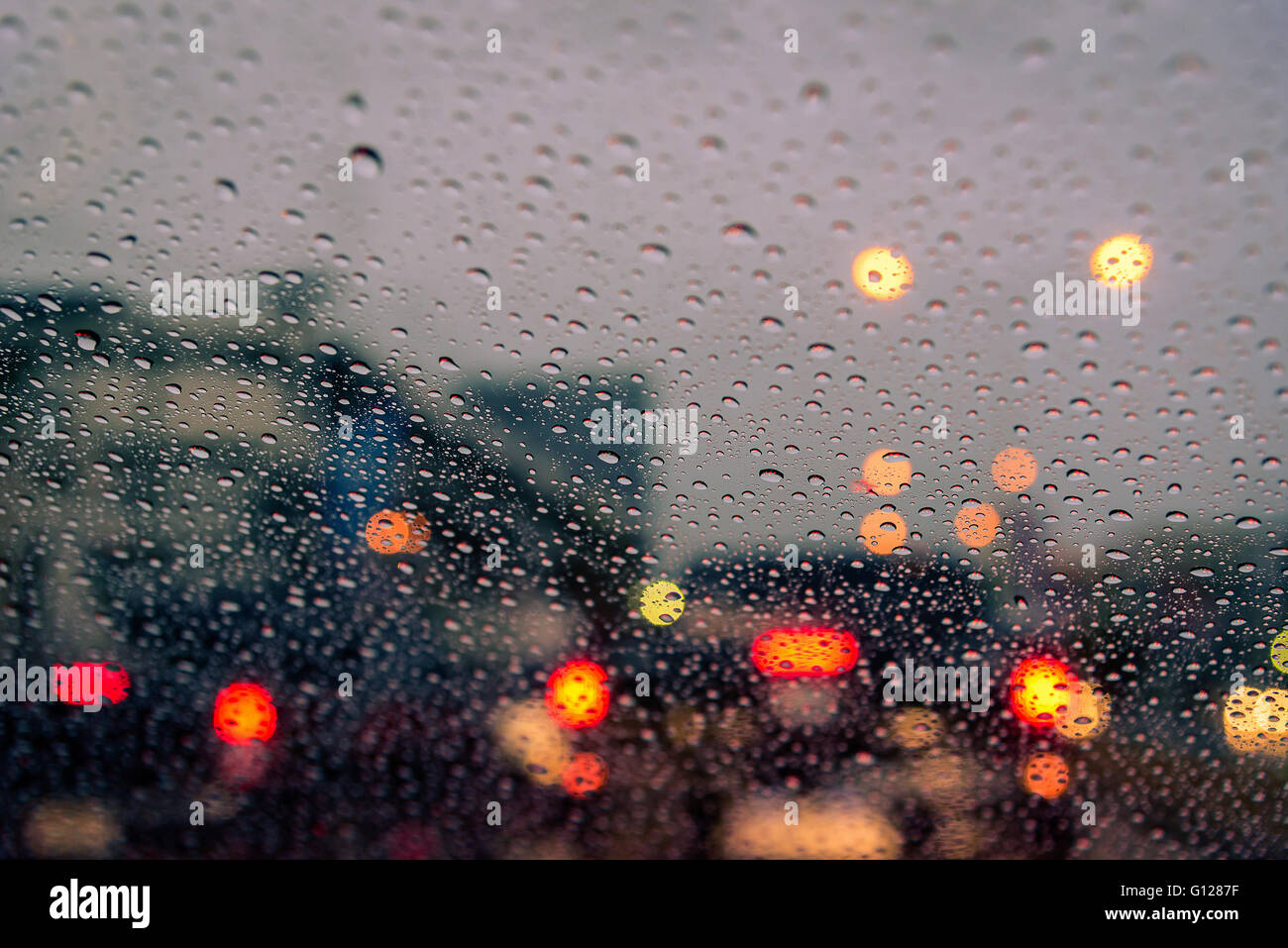 Rain drops on the window with traffic light. Selective focus Stock ...