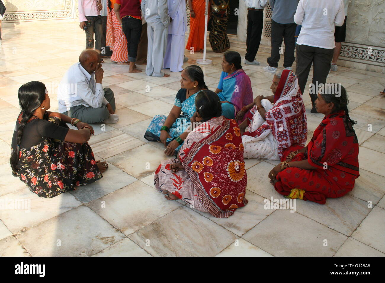 Indian people sitting at the Taj Mahal, UNESCO World Heritage Site ...