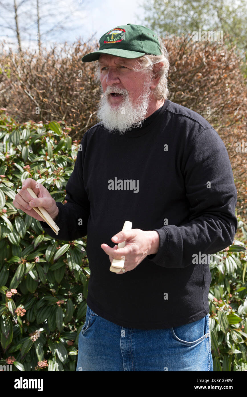 Man playing the musical bones, an Old folk instrument Stock Photo - Alamy