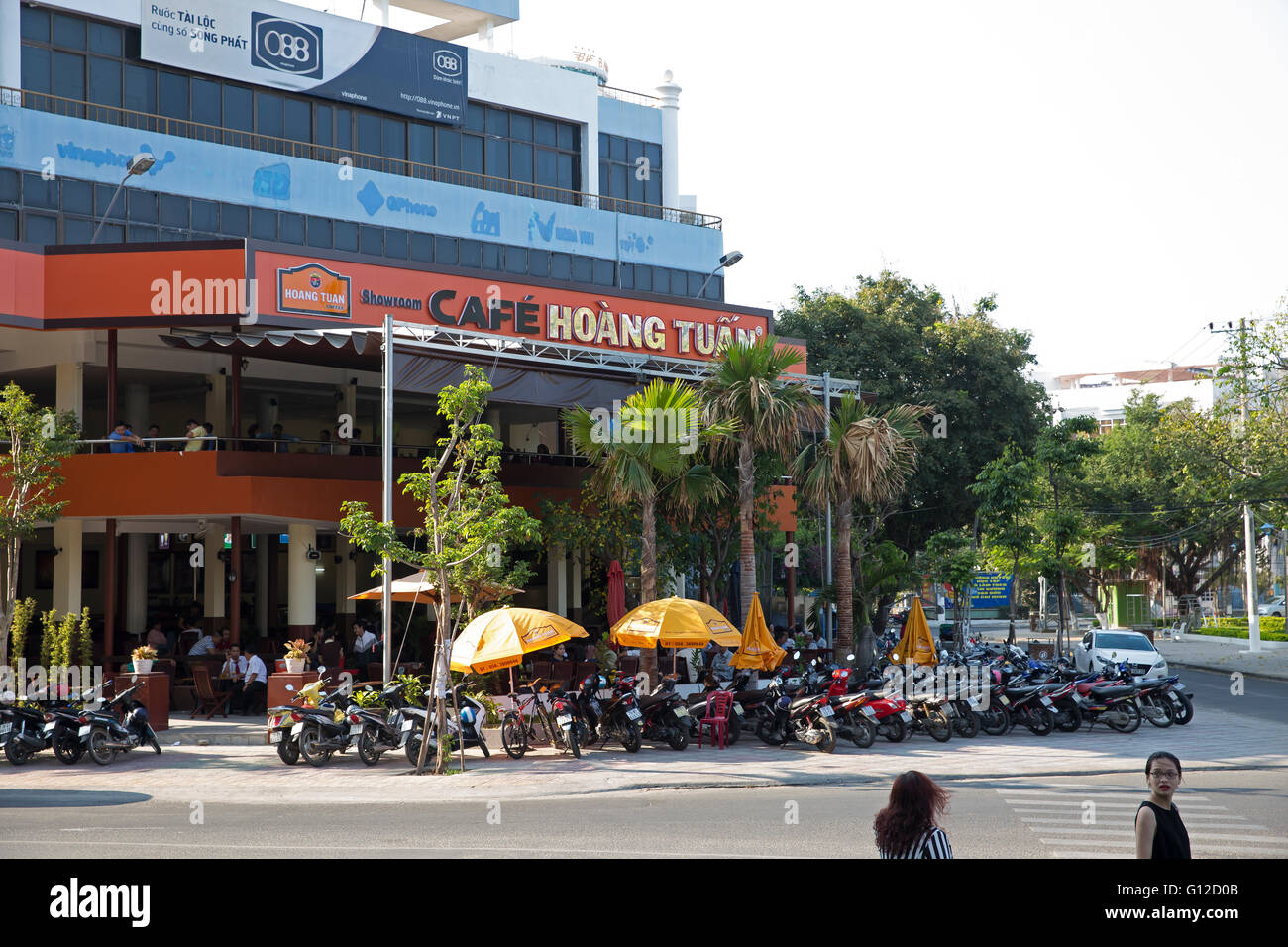 Cafe Hoang Tuam with scooters parked outside in Nha Trang Stock Photo ...