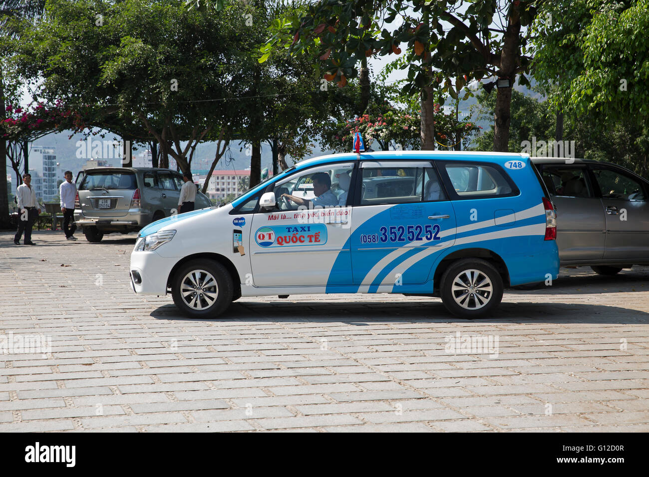 Blue and white taxi in Nha Trang Vietnam Stock Photo - Alamy