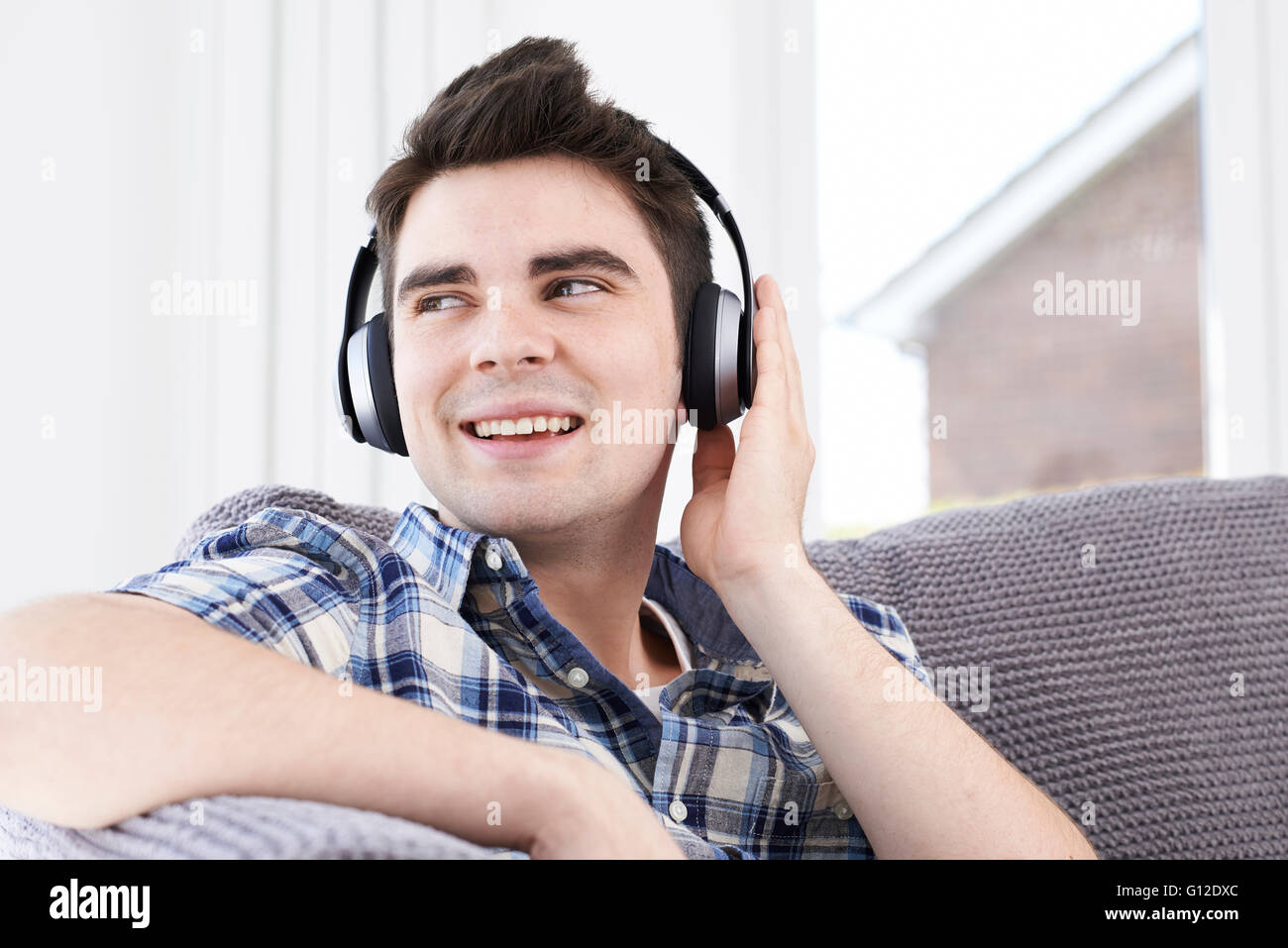 Happy man wireless headphones hi-res stock photography and images - Alamy
