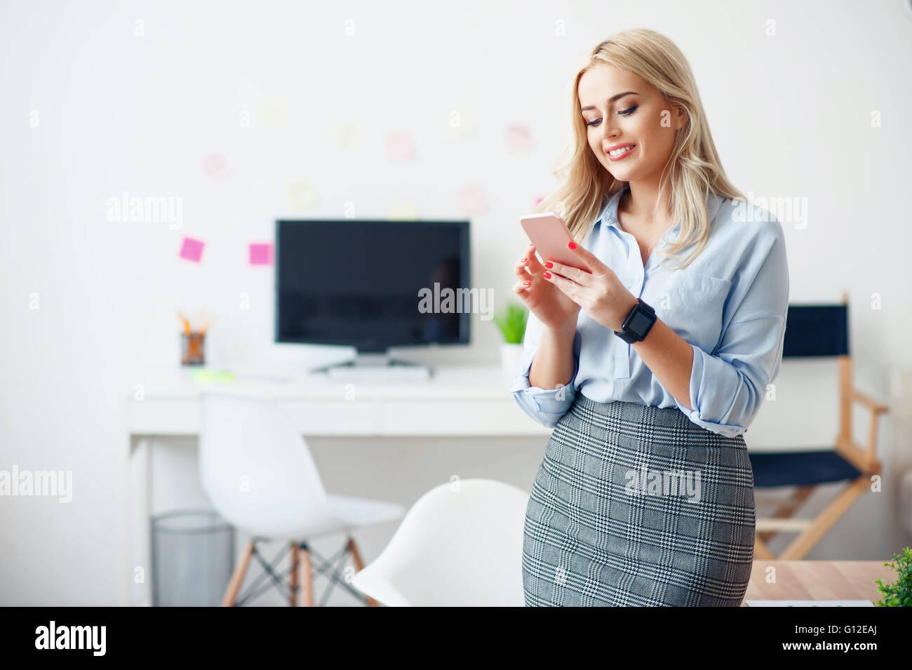 Pleasant woman using cell hi-res stock photography and images - Alamy