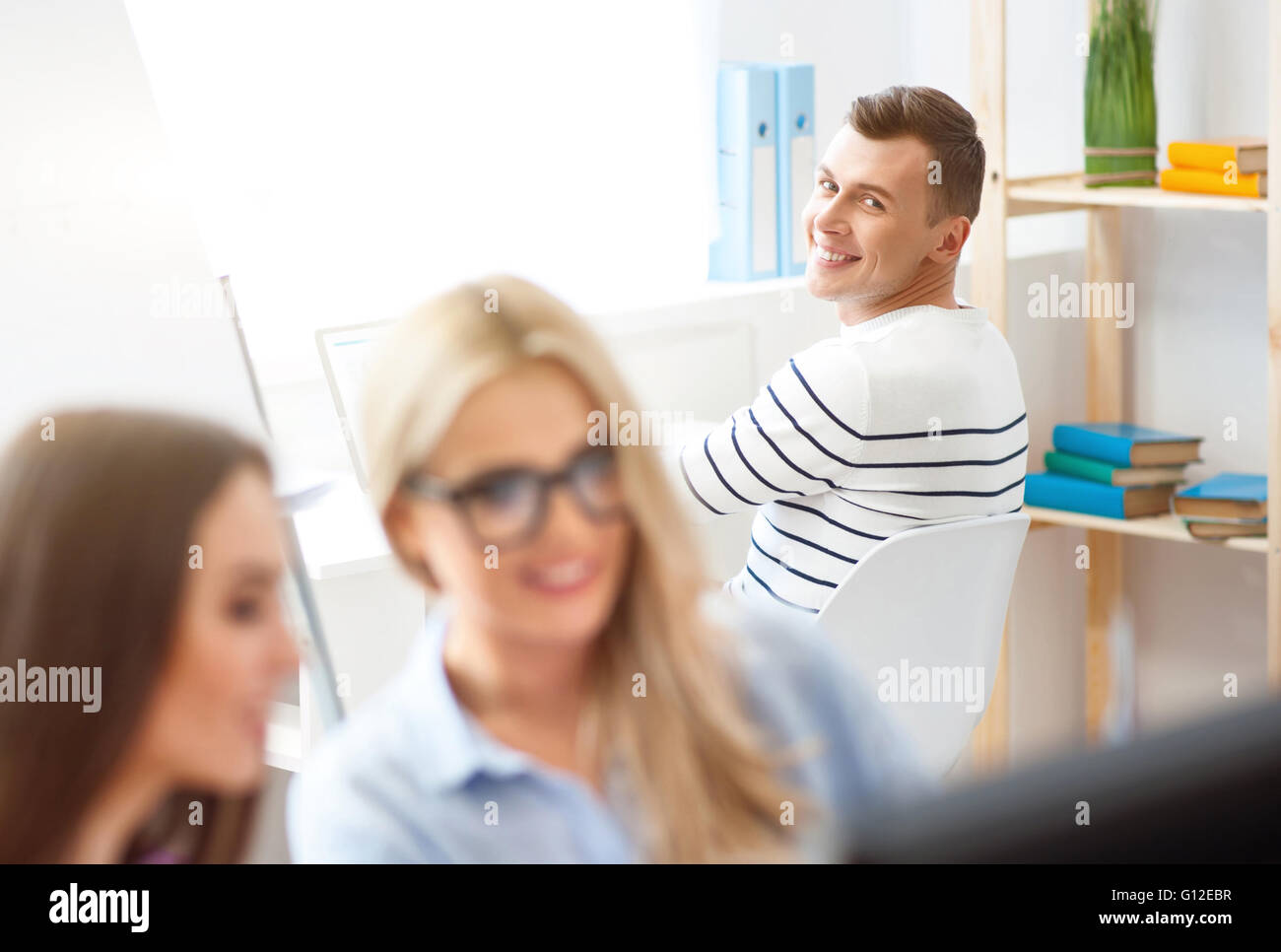 Pleasant guy working in the office Stock Photo - Alamy