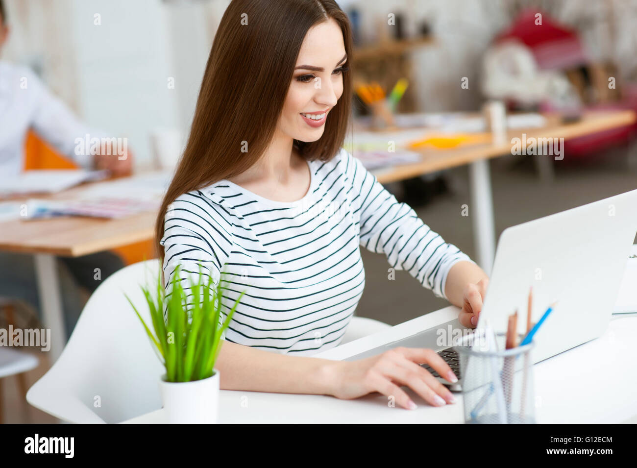 Positive woman working in the office Stock Photo - Alamy
