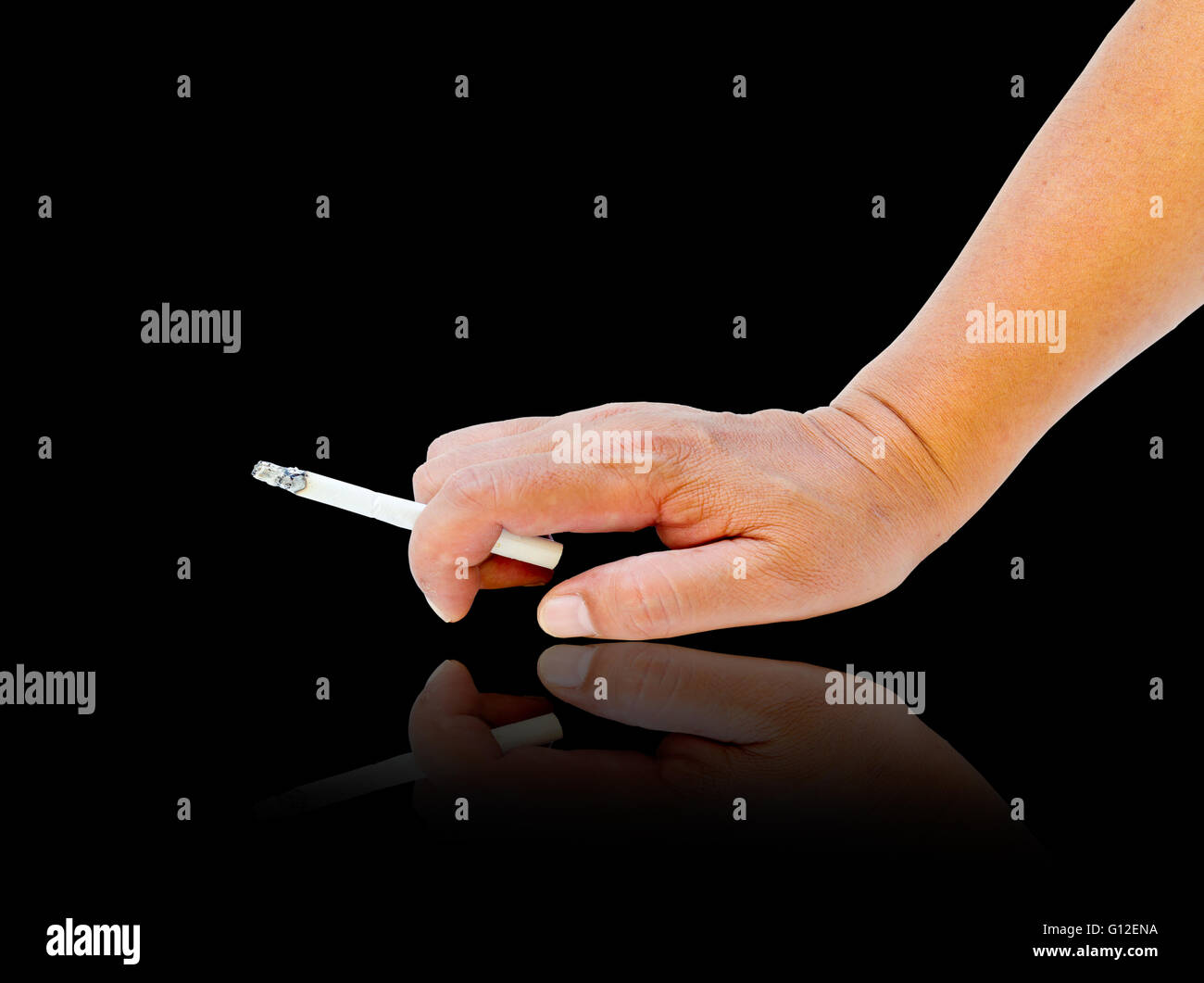 Hand and a cigarette in hand isolated on black background Stock Photo ...