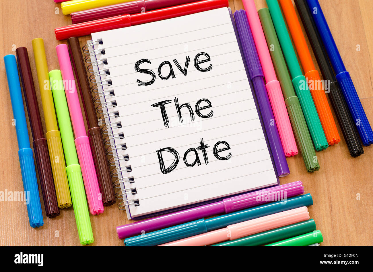 Save the date text concept and colored pens Stock Photo - Alamy
