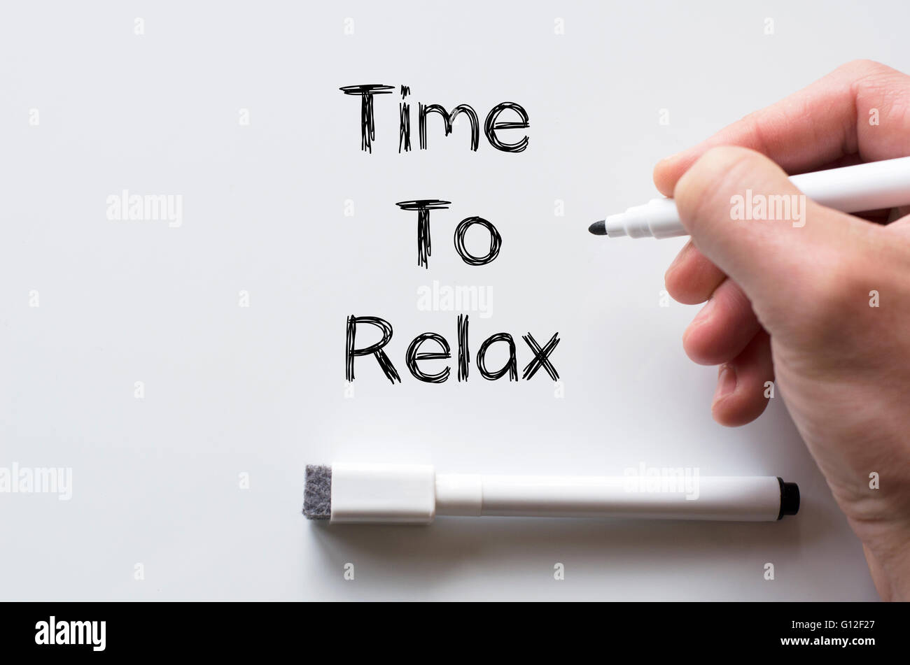Human hand writing time to relax on whiteboard Stock Photo - Alamy