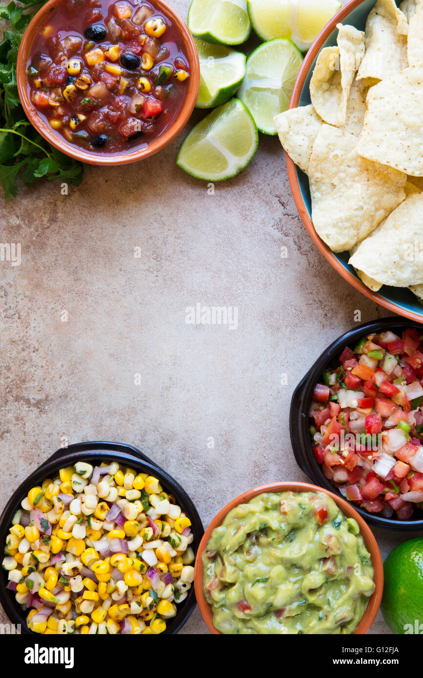 Tortilla chips served with guacamole, salsa, and pico de gallo with ...