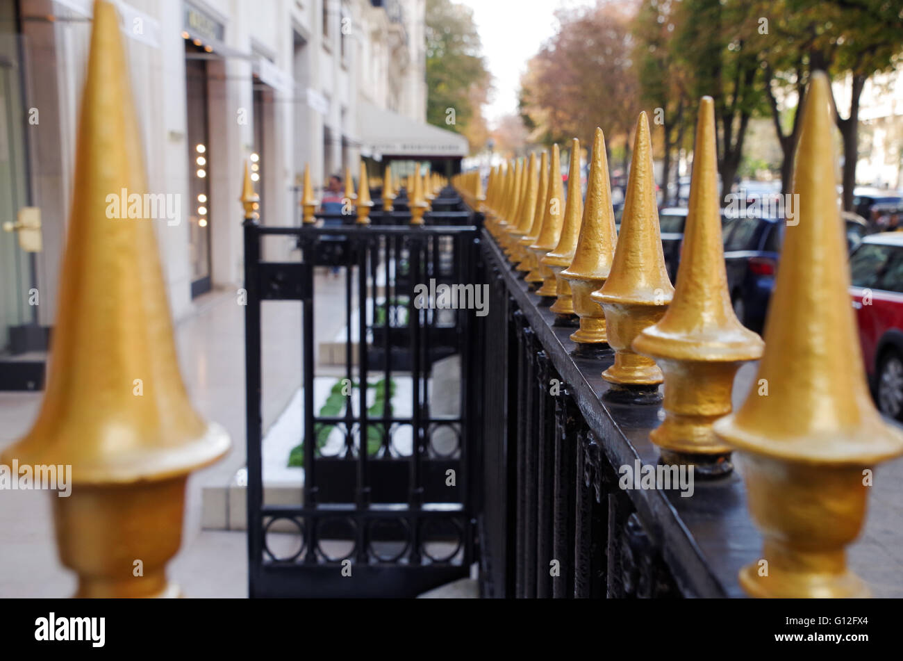 Gilded railing spikes in front of designer stores in Avenue de ...