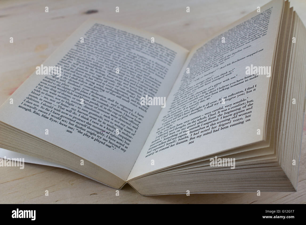 English ancient open book on wooden background Stock Photo - Alamy