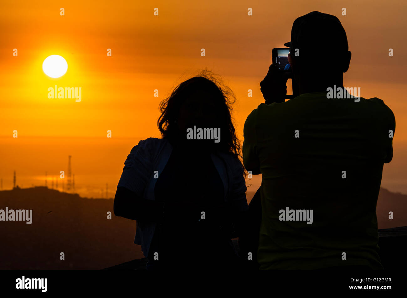 People in the sunset Stock Photo - Alamy