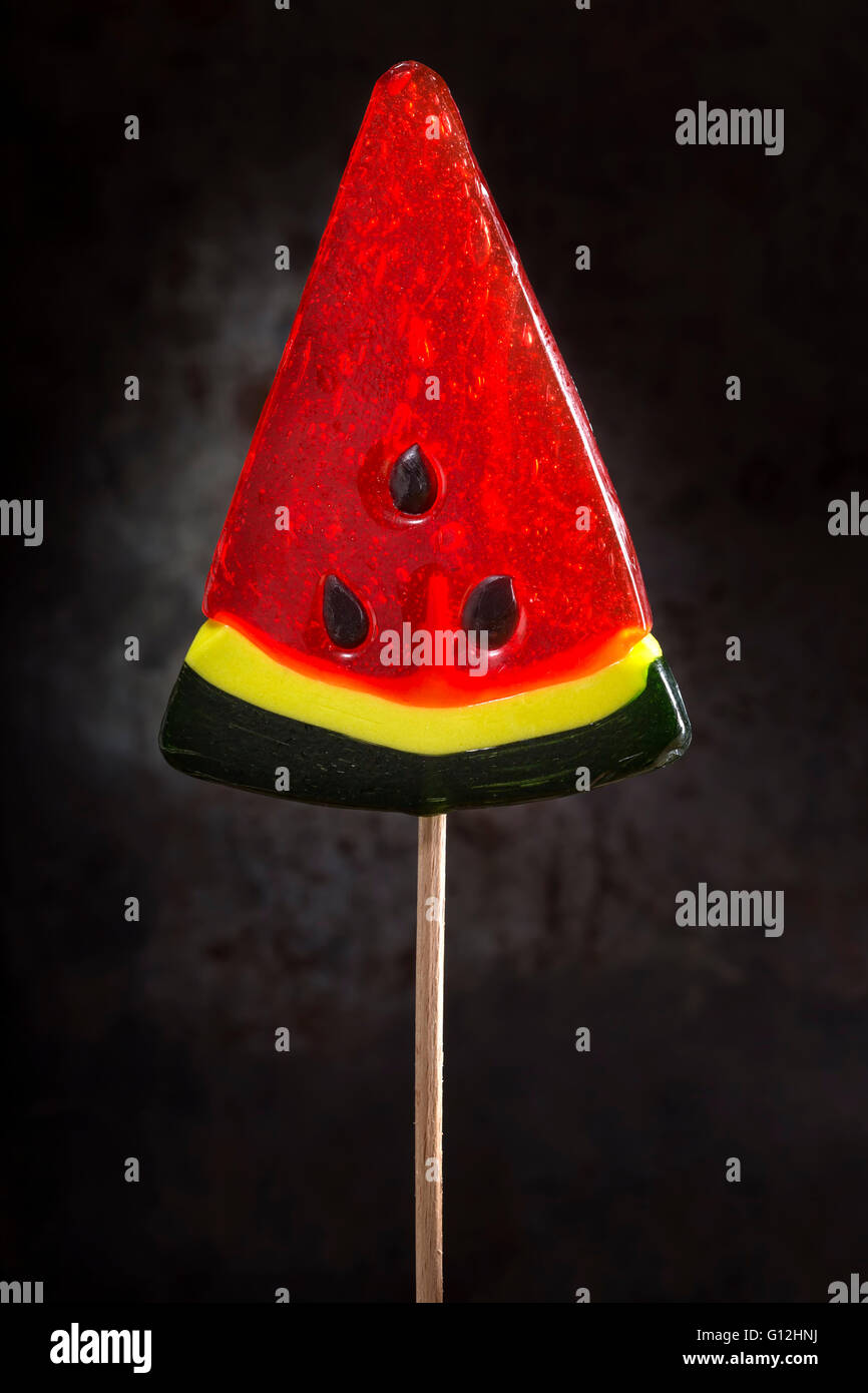 Lollipop in the form of a watermelon over dark background Stock Photo ...