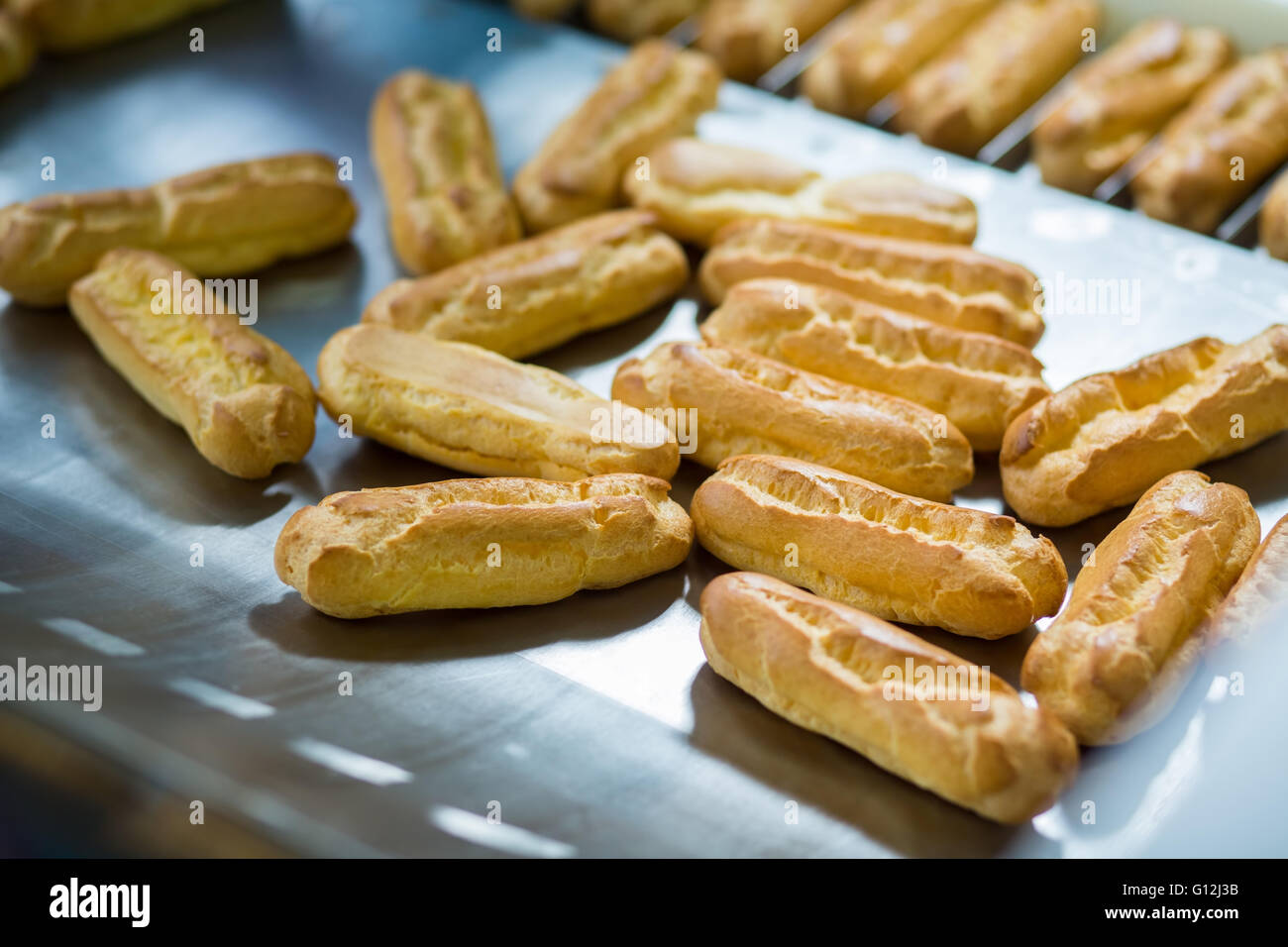 Eclair shells on metal surface Stock Photo - Alamy