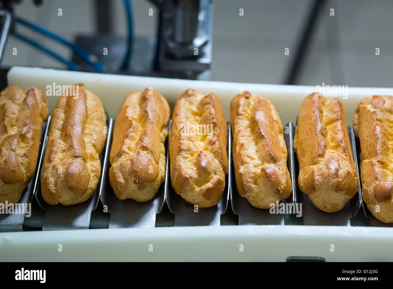 Automatic line production eclairs hi-res stock photography and images ...
